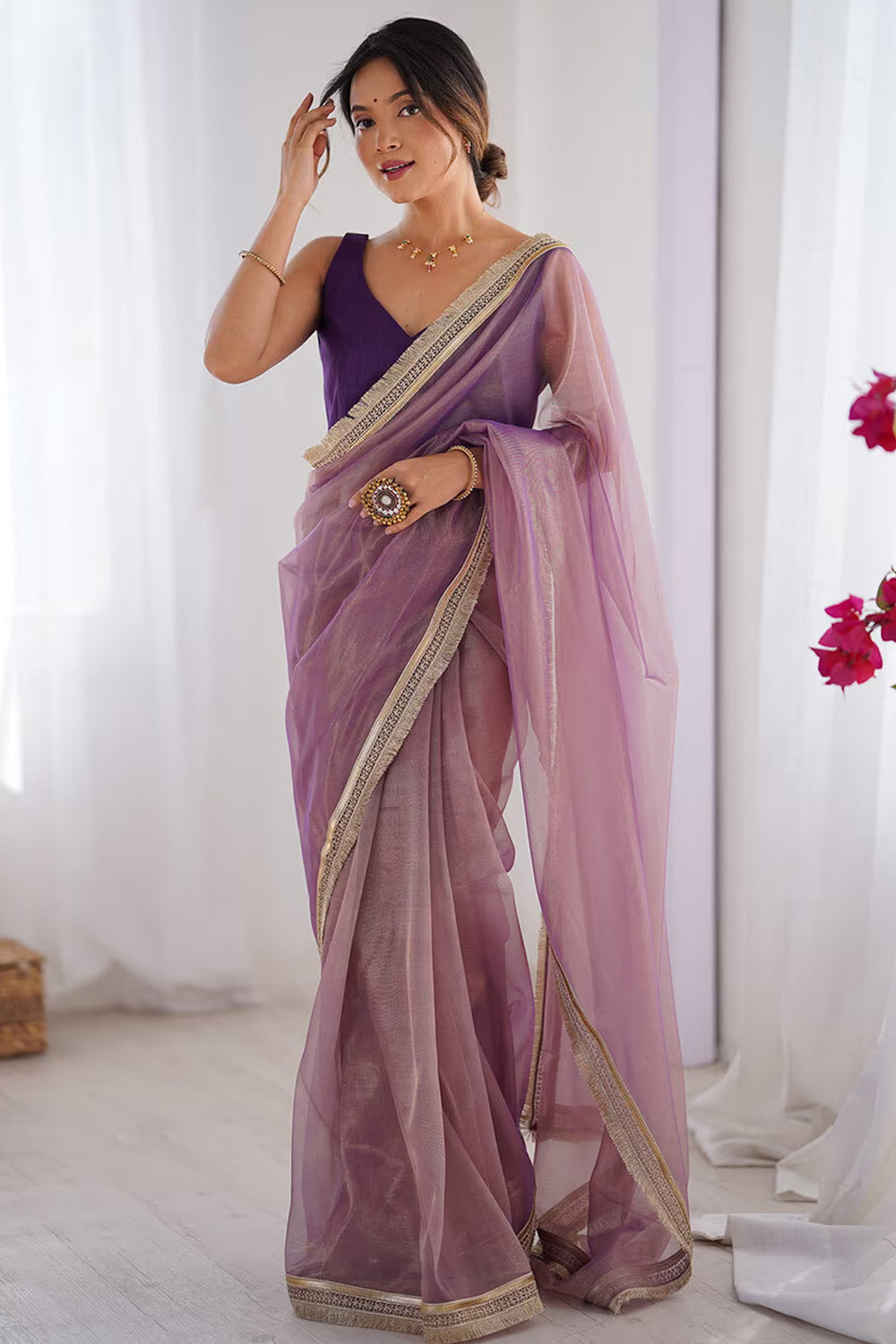 Purple Solid Pattern Net Saree with Refined Lace Work for Parties