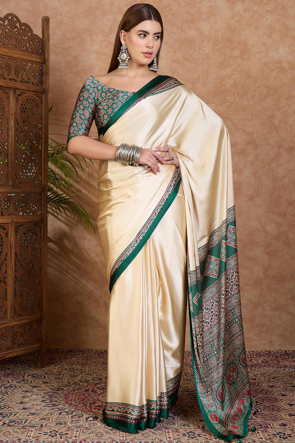 Cream & Green Modal Satin Saree Featuring a Solid Base and Artisanal A