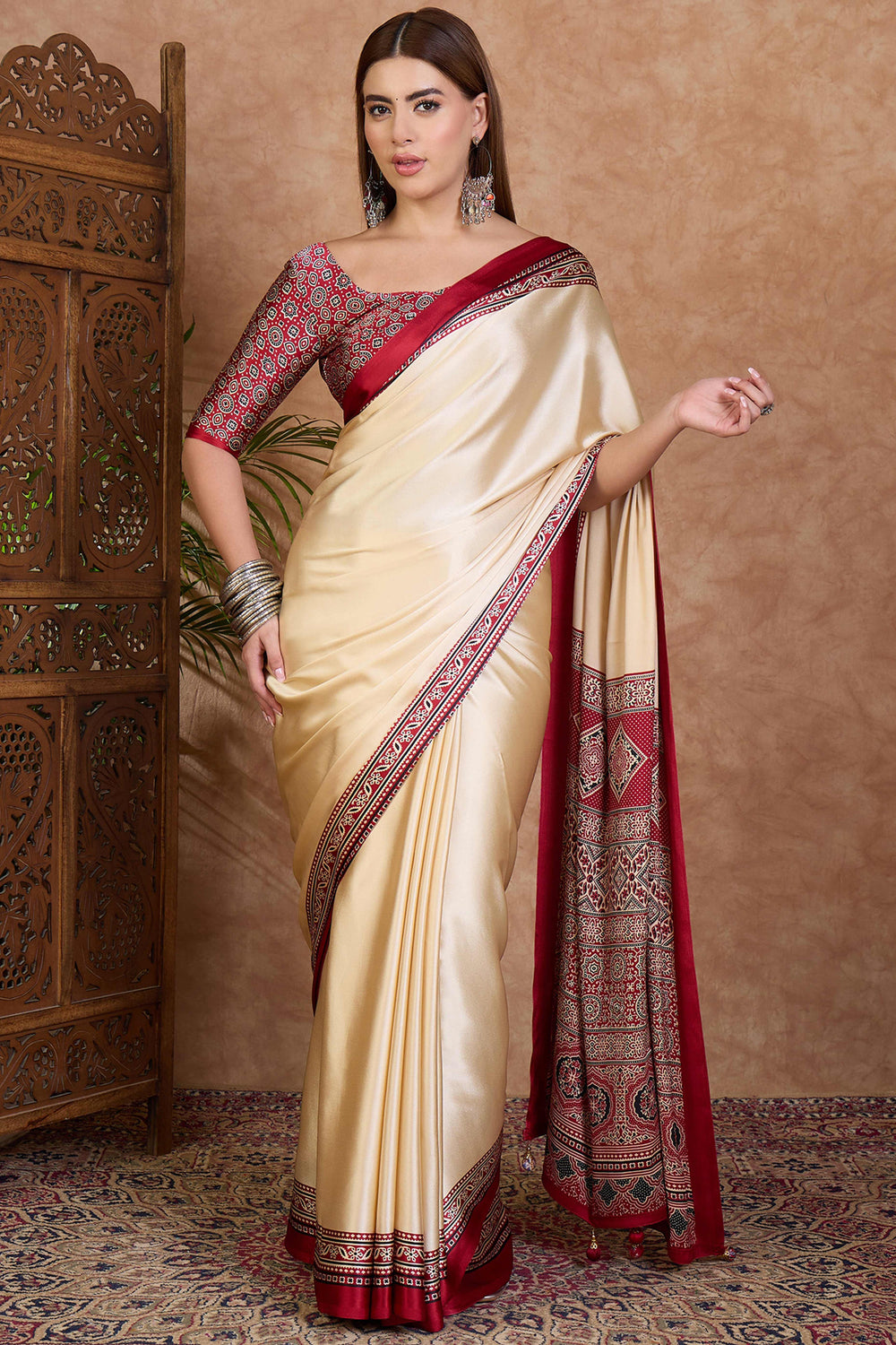 Cream & Red Modal Satin Saree Featuring a Solid Base and Artisanal Ajr