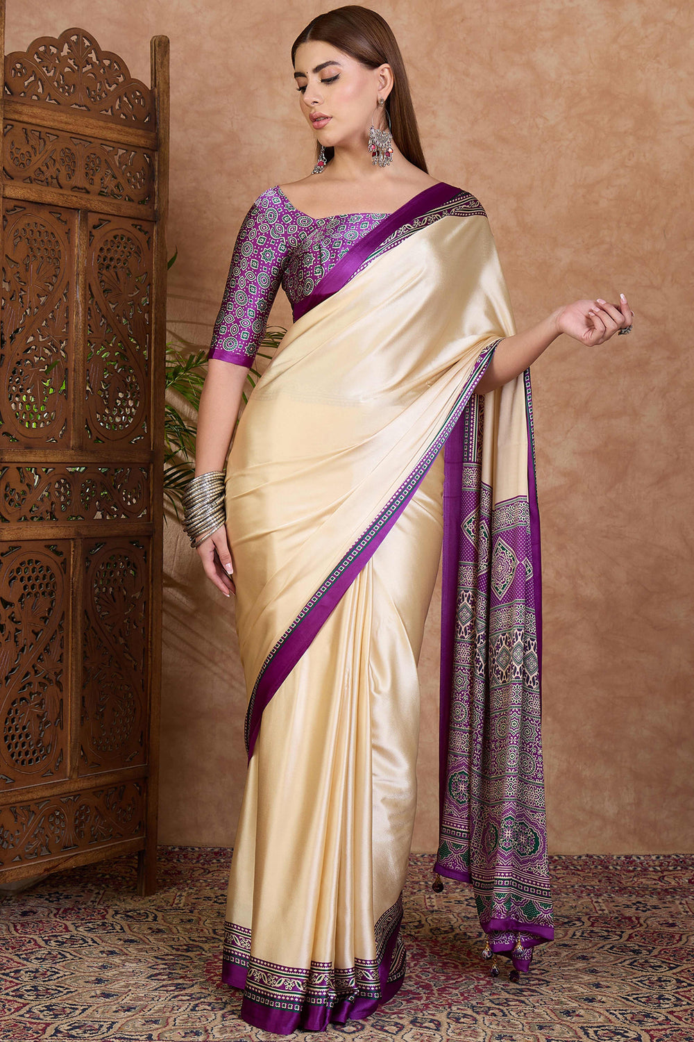 Cream & Purple Modal Satin Saree Featuring a Solid Base and Artisanal