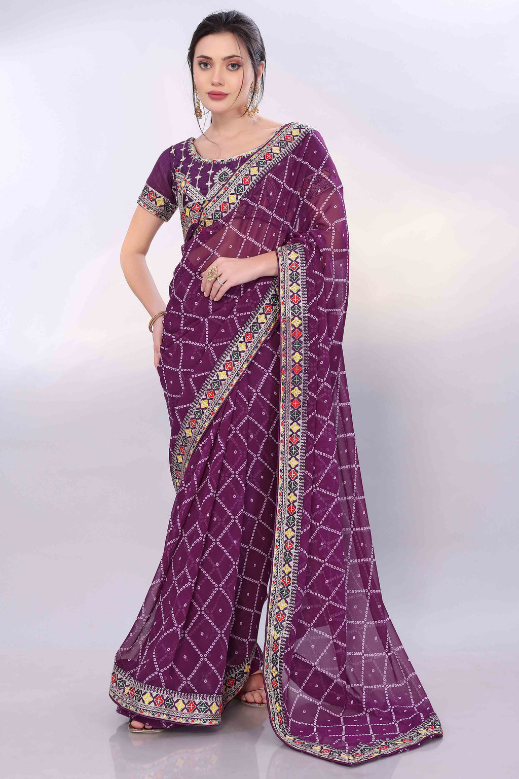 Wine Bandhani Printed Georgette Saree Framed With Elegant Embroidered