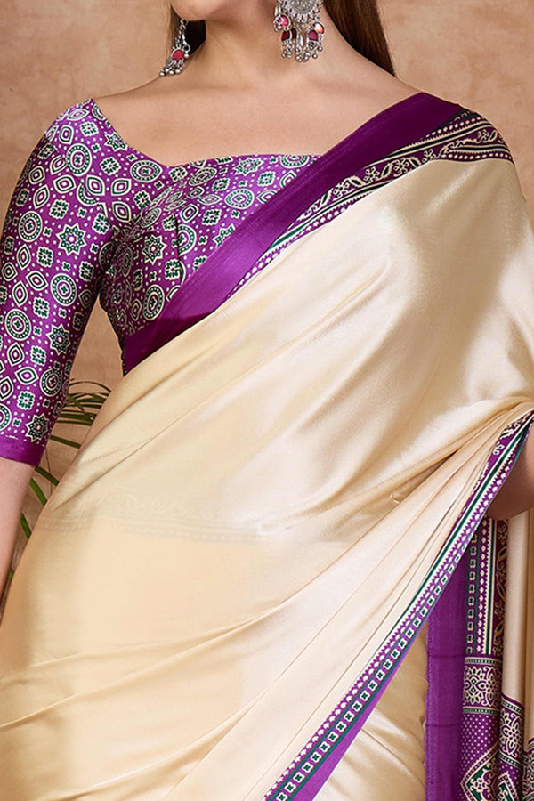 Cream & Purple Modal Satin Saree Featuring a Solid Base and Artisanal