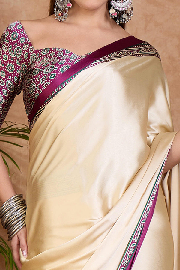 Cream & Wine Modal Satin Saree Featuring a Solid Base and Artisanal Aj